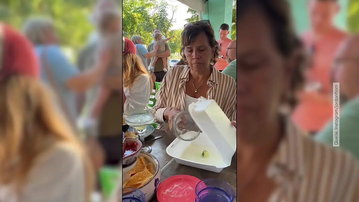 Reste einpacken - ja oder nein?: Frau lässt Cocktail in Essensbox mitgehen